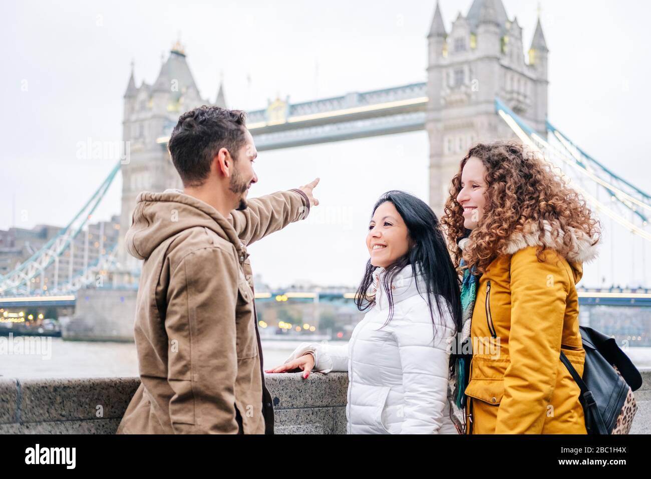 London, United Kingdom, Group of friends looking at Tower Bridge Stock ...