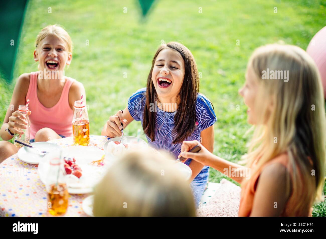 Happy girls having a birthday party outdoors Stock Photo - Alamy
