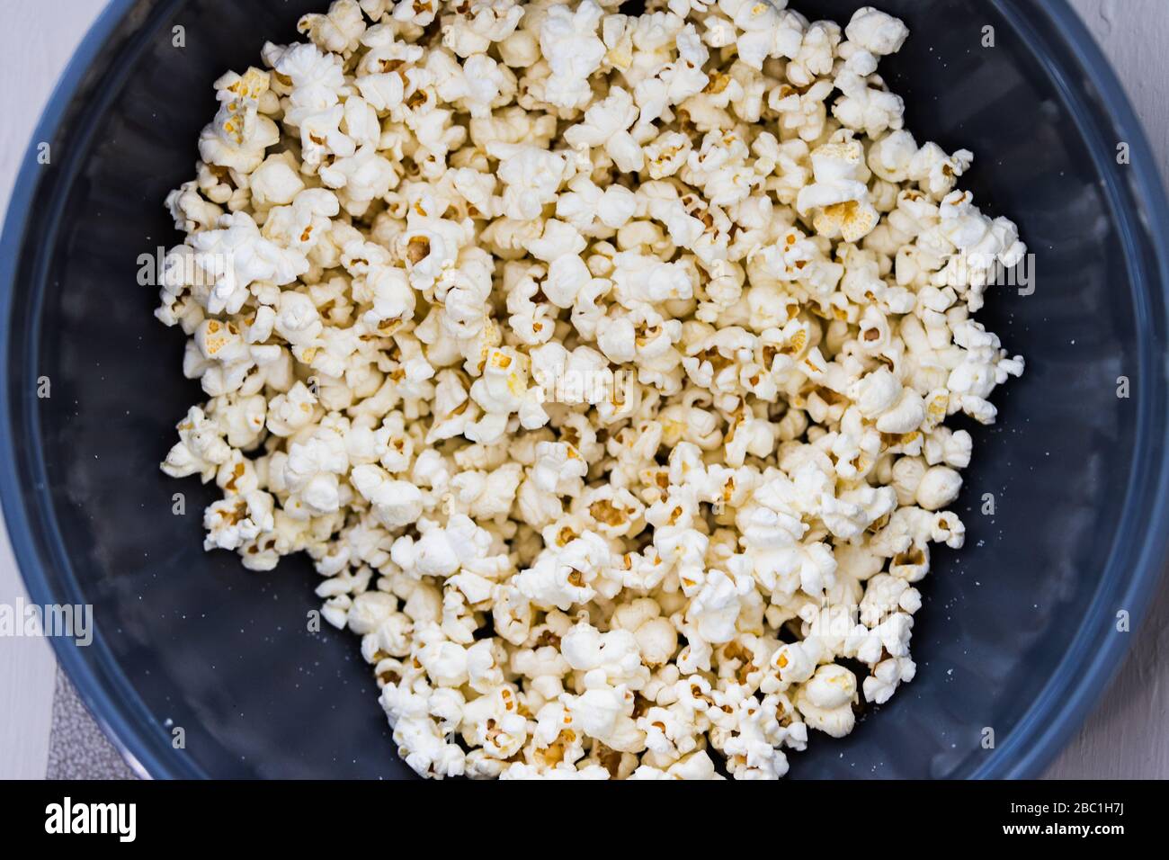 Overhead of large bowl filled with freshly popped popcorn Stock Photo ...