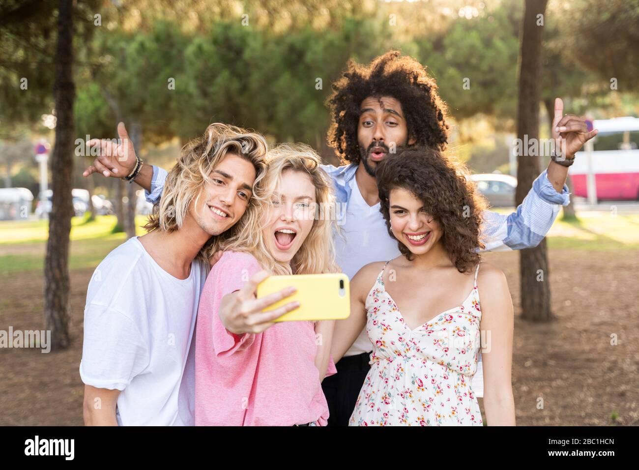 Happy millennials taking group selfie hi-res stock photography and ...