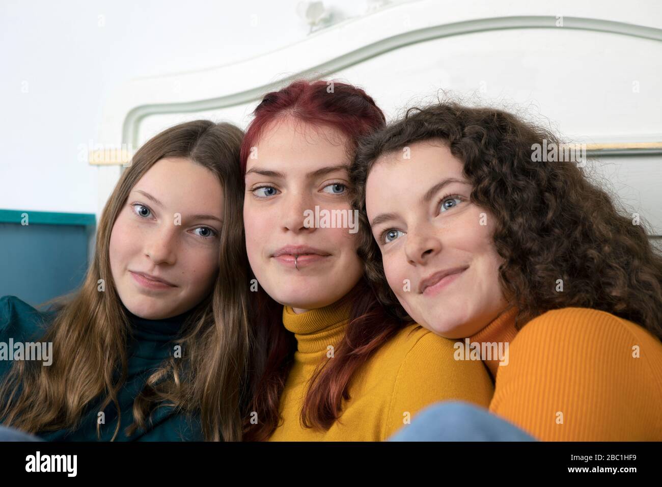 Portrait of three happy sisters Stock Photo - Alamy