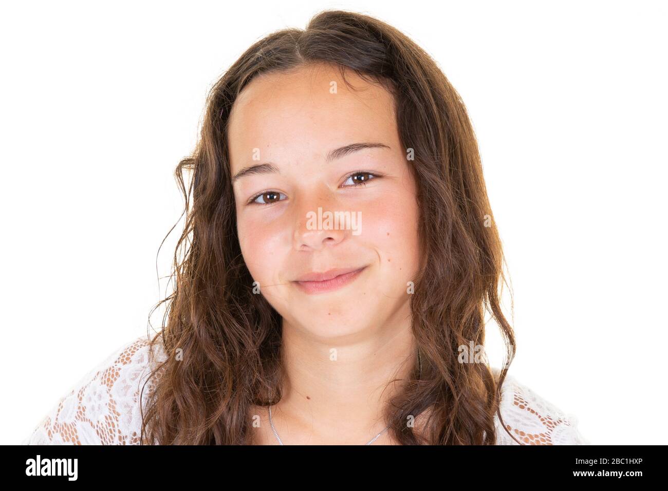 Portrait Of Young Beautiful Girl Smiling Looking At Camera Over White