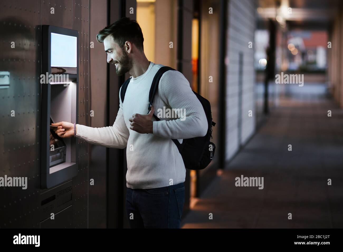 Man withdrawing money atm hi-res stock photography and images - Alamy