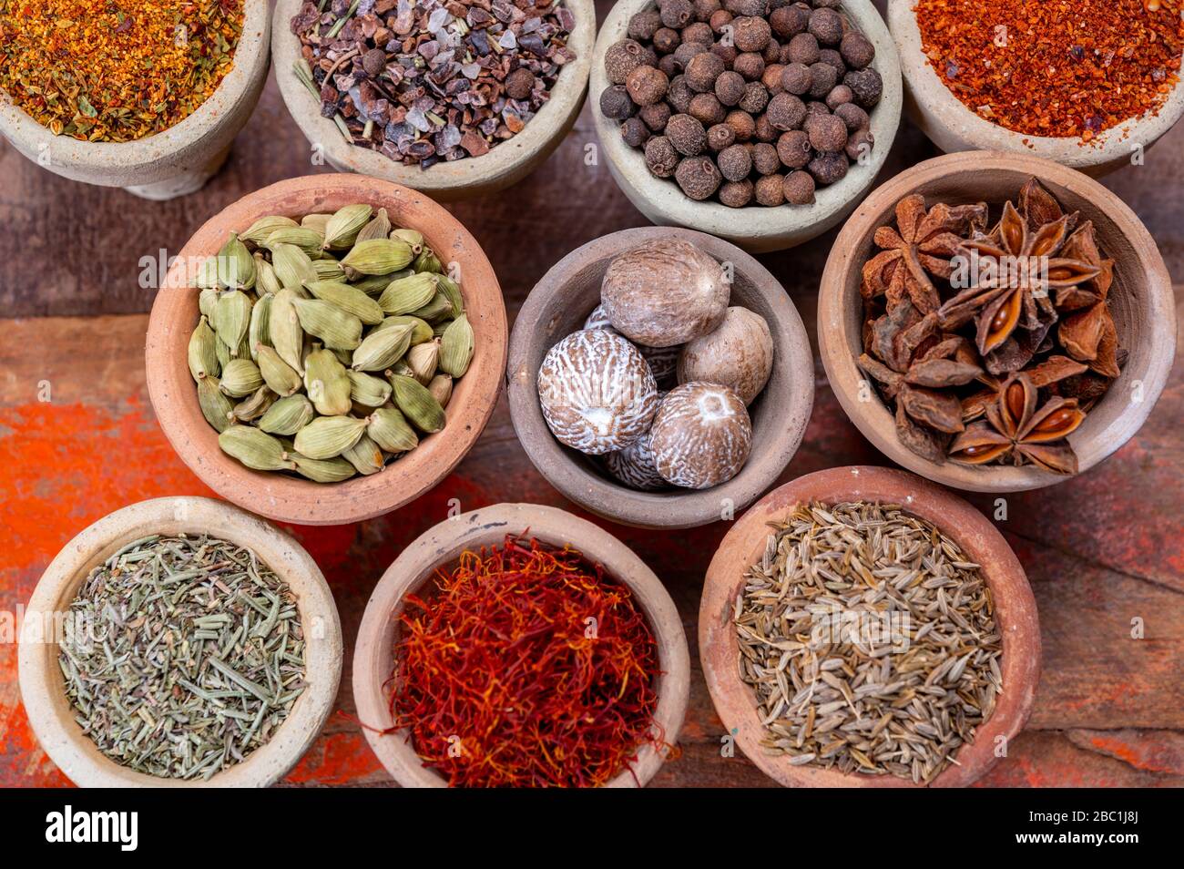Indian spices collection, dried colorful condiment, nuts, pods and ...