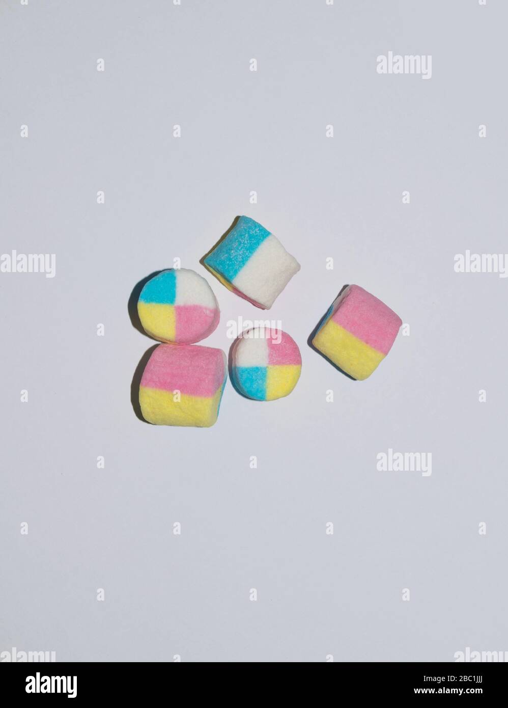 Colorful cylinder shape sweet candies isolated on white background ...