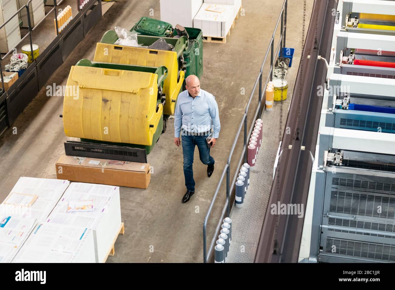 Businessman walking factory workshop hi-res stock photography and ...