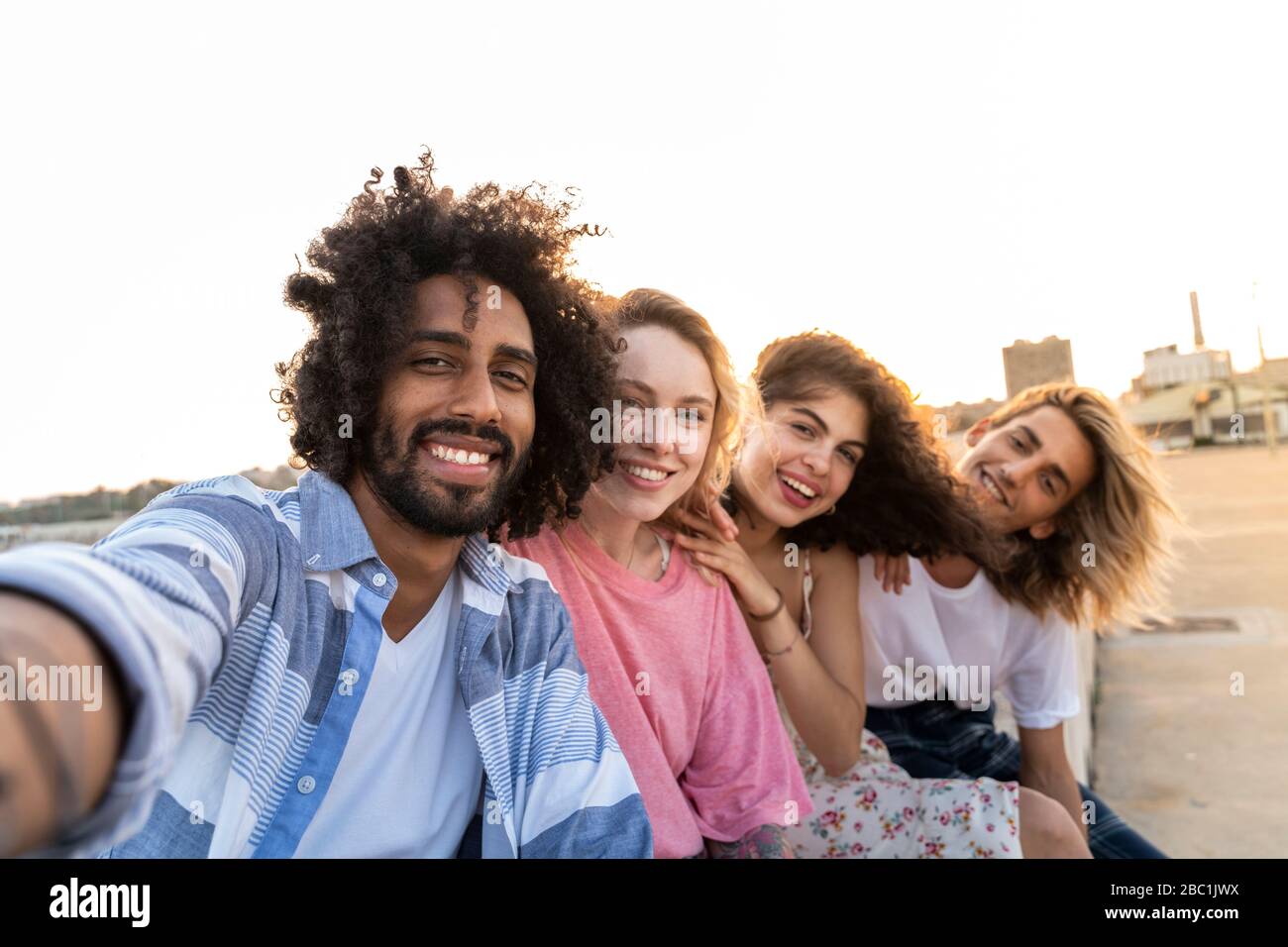 Portrait of happy friends outdoors Stock Photo - Alamy