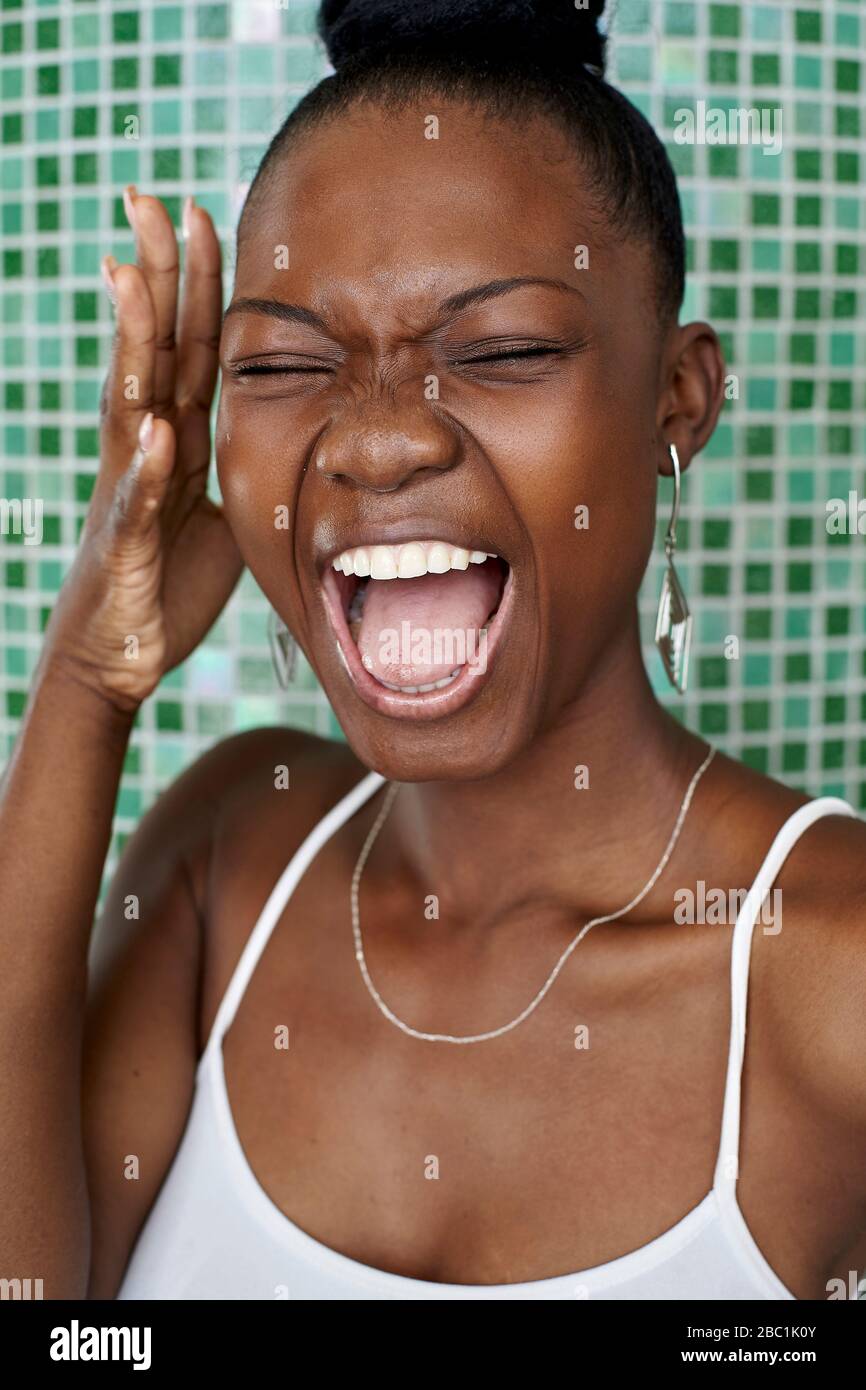 Young woman screaming Stock Photo - Alamy