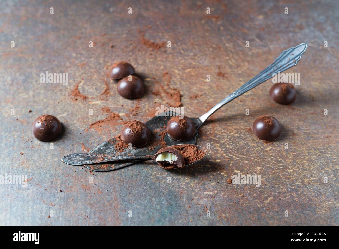 Chocolate pralines with vanilla filling Stock Photo - Alamy