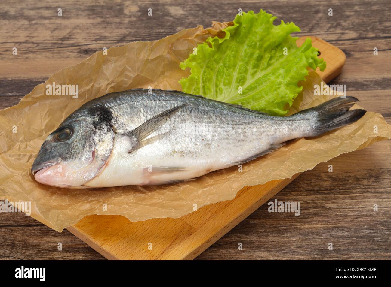 Raw Dorada fish ready for cooking Stock Photo - Alamy