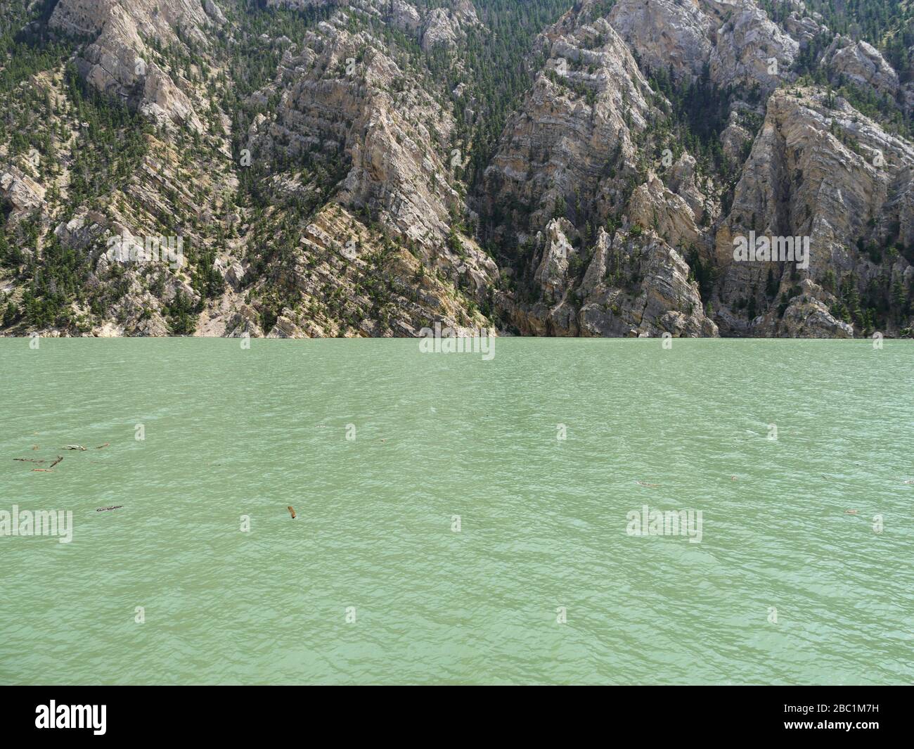 Buffalo Bill Reservoir and Dam in Wyoming, bordered by scenic rock and ...