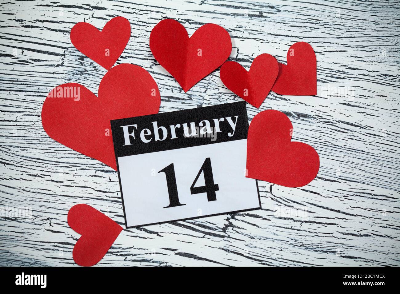 February 14, on the calendar, Valentine's day, heart from red paper ...