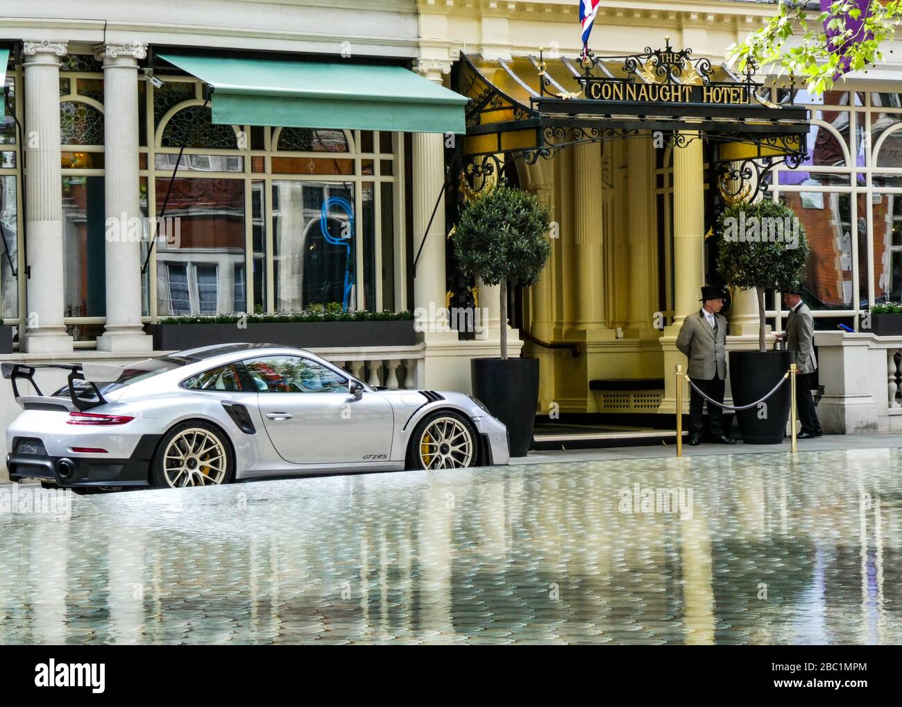 MAYFAIR, LONDON- Expensive luxury cars parked outside Mayfair's 5 star ...