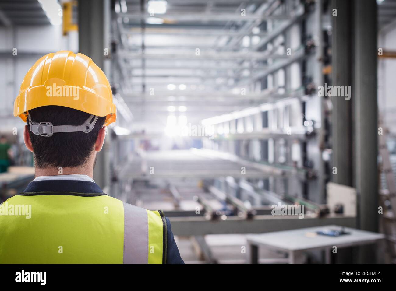 Male supervisor watching steel factory Stock Photo - Alamy