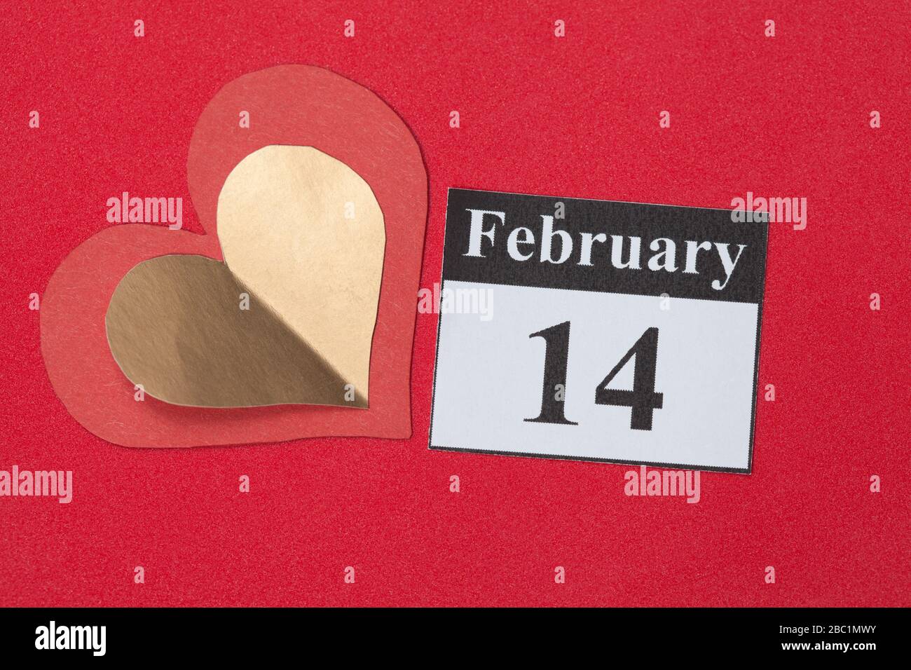 February 14, on the calendar, Valentine's day, heart from red paper ...