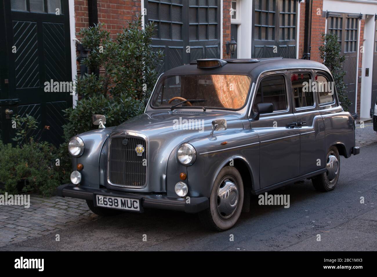 An old London taxi cab modified for personal use Stock Photo - Alamy