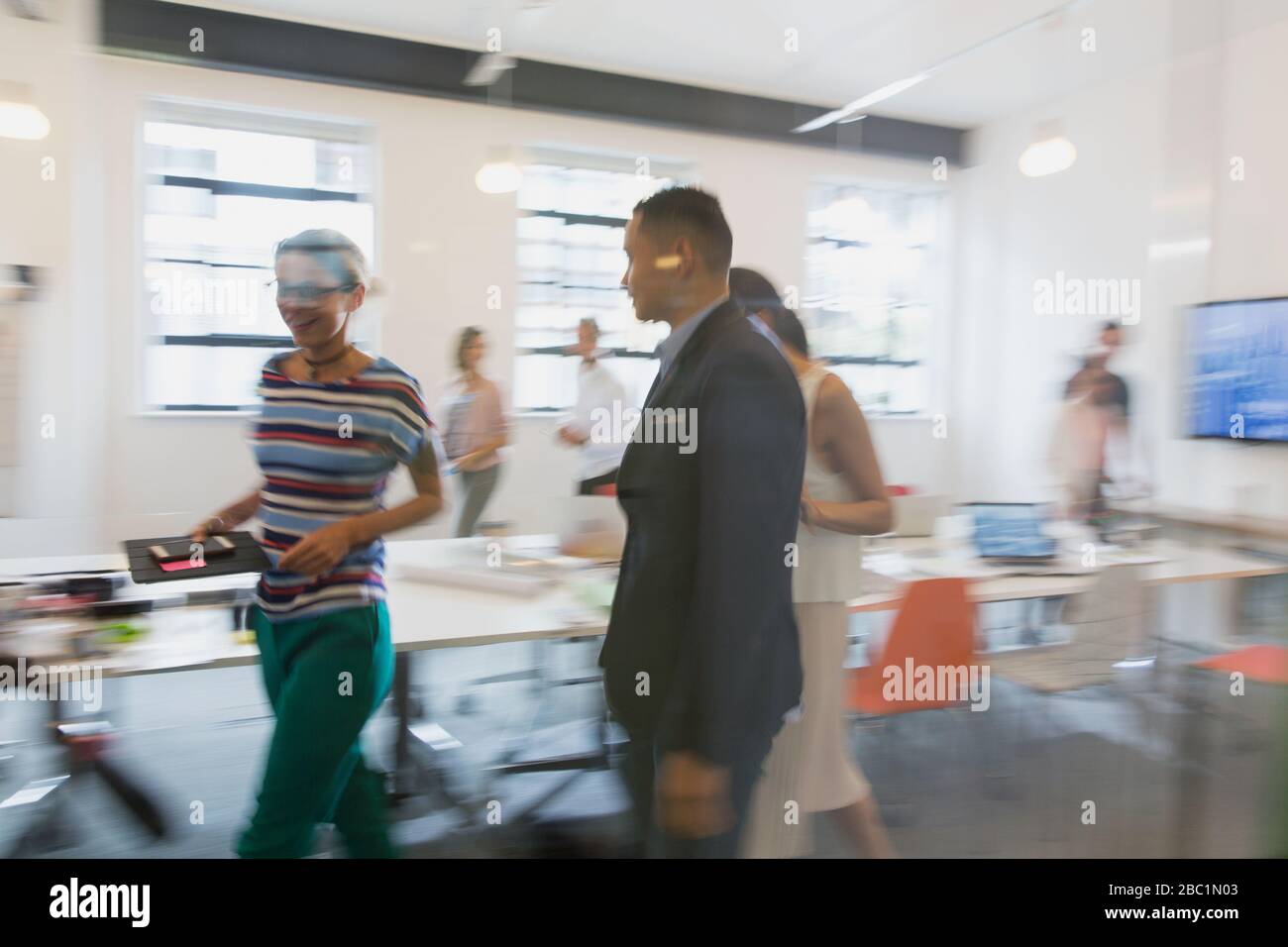 Business people leaving conference room meeting Stock Photo - Alamy