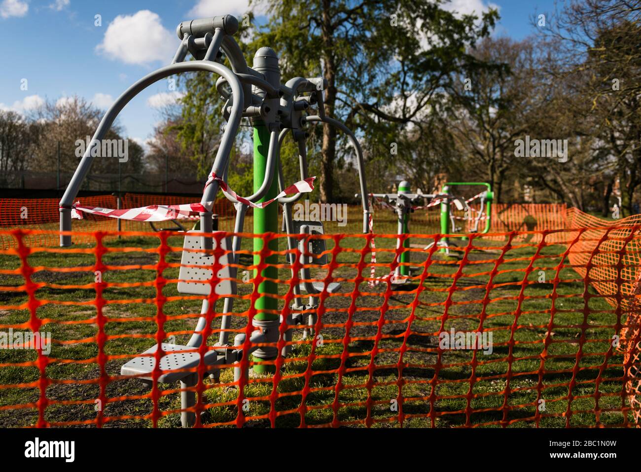 Public exercise equipment taped and fenced off to prevent use during ...