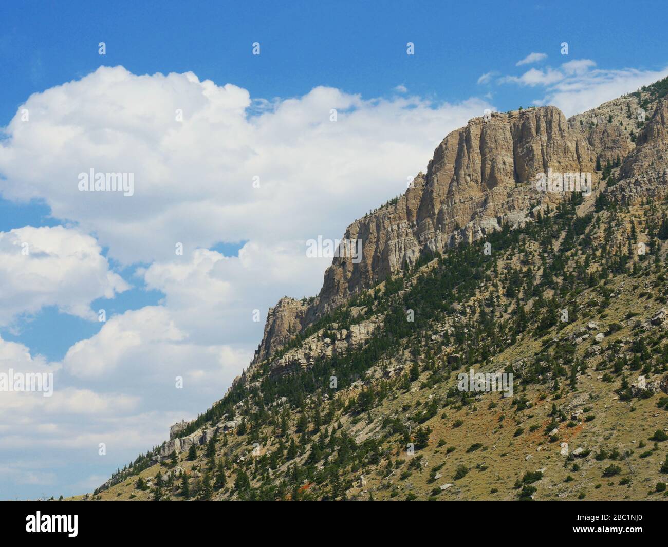 Impressive rock and geologic formations at teh peak of a high mountain ...
