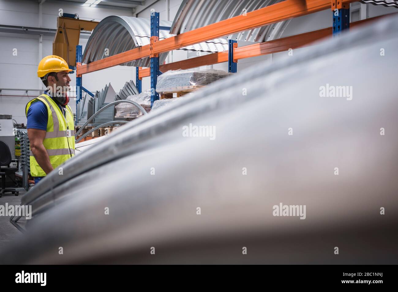 Male worker in steel factory Stock Photo - Alamy