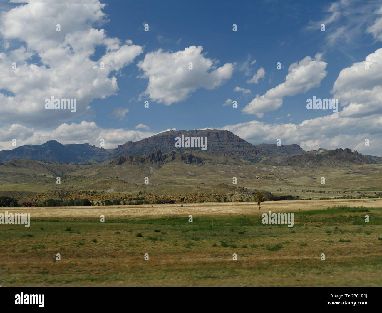 Wyoming landscape with mountains and rock formations in the distance ...