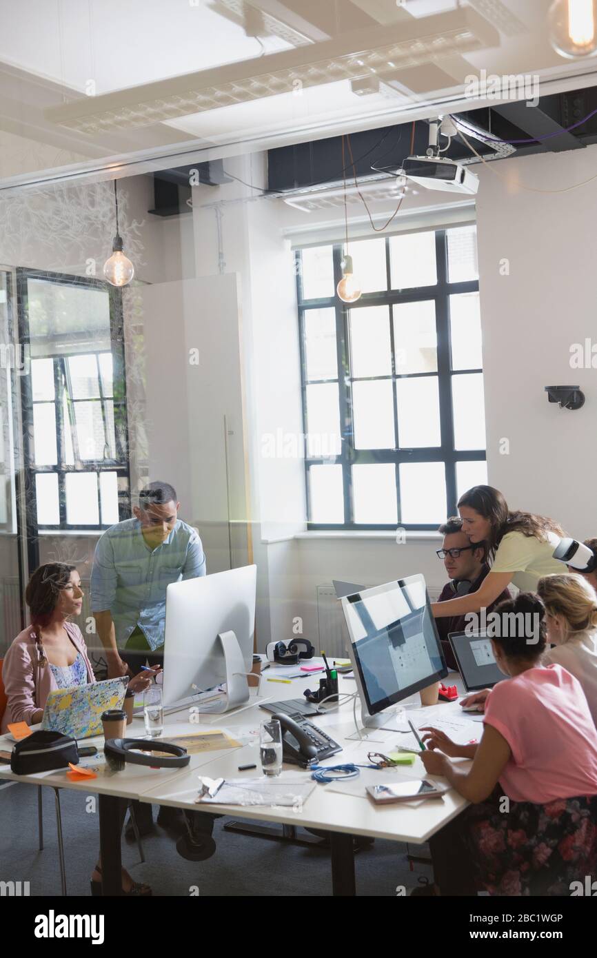 Designers working in open plan office Stock Photo - Alamy