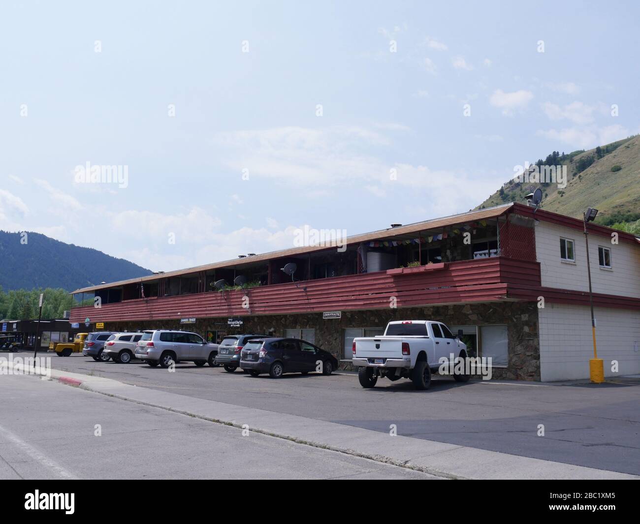 Jackson Hole, Wyoming- August 2018: Wide street view with cars parked ...