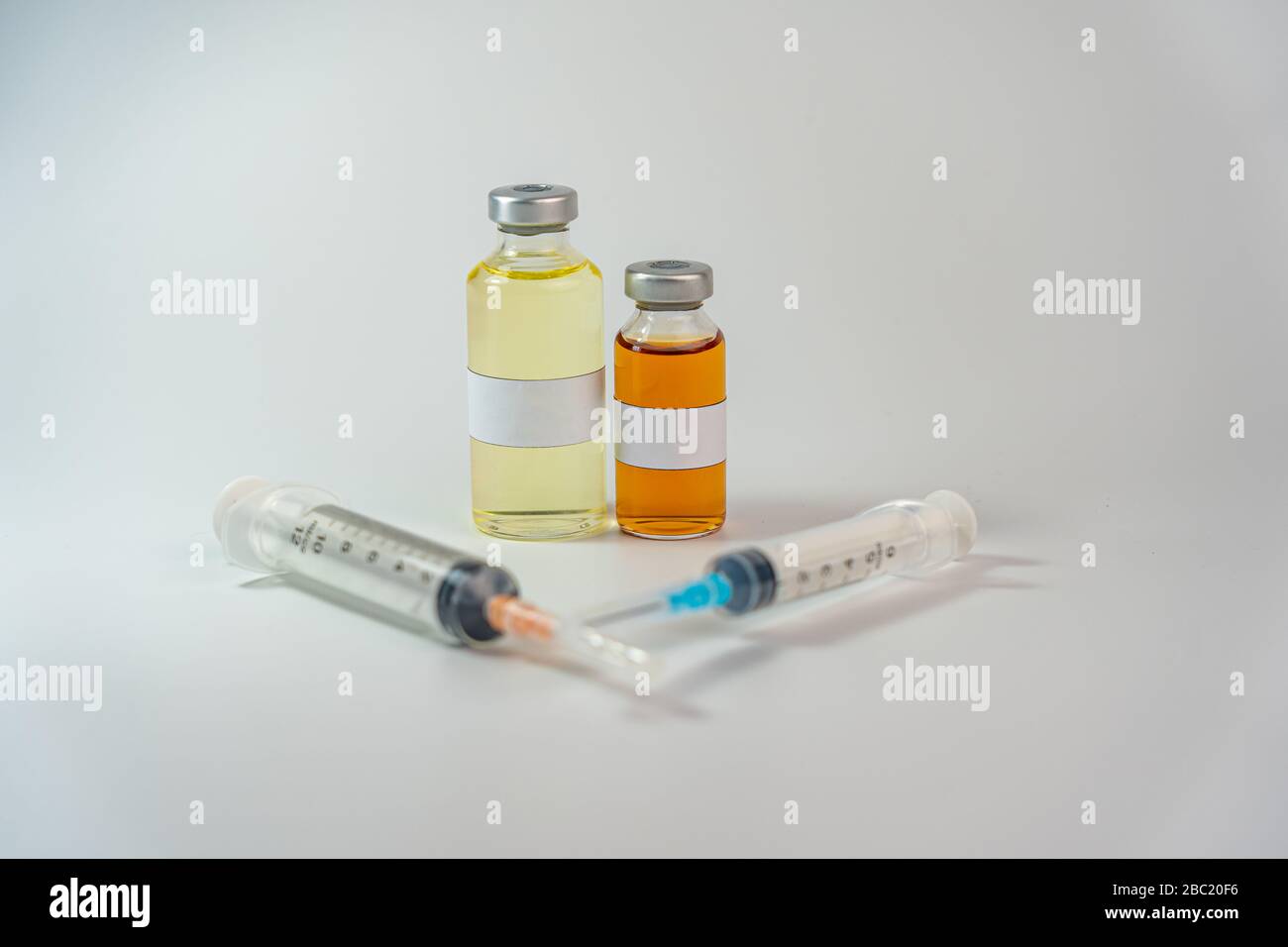 Two vaccine bottle with blank label and syringe injection Stock Photo ...