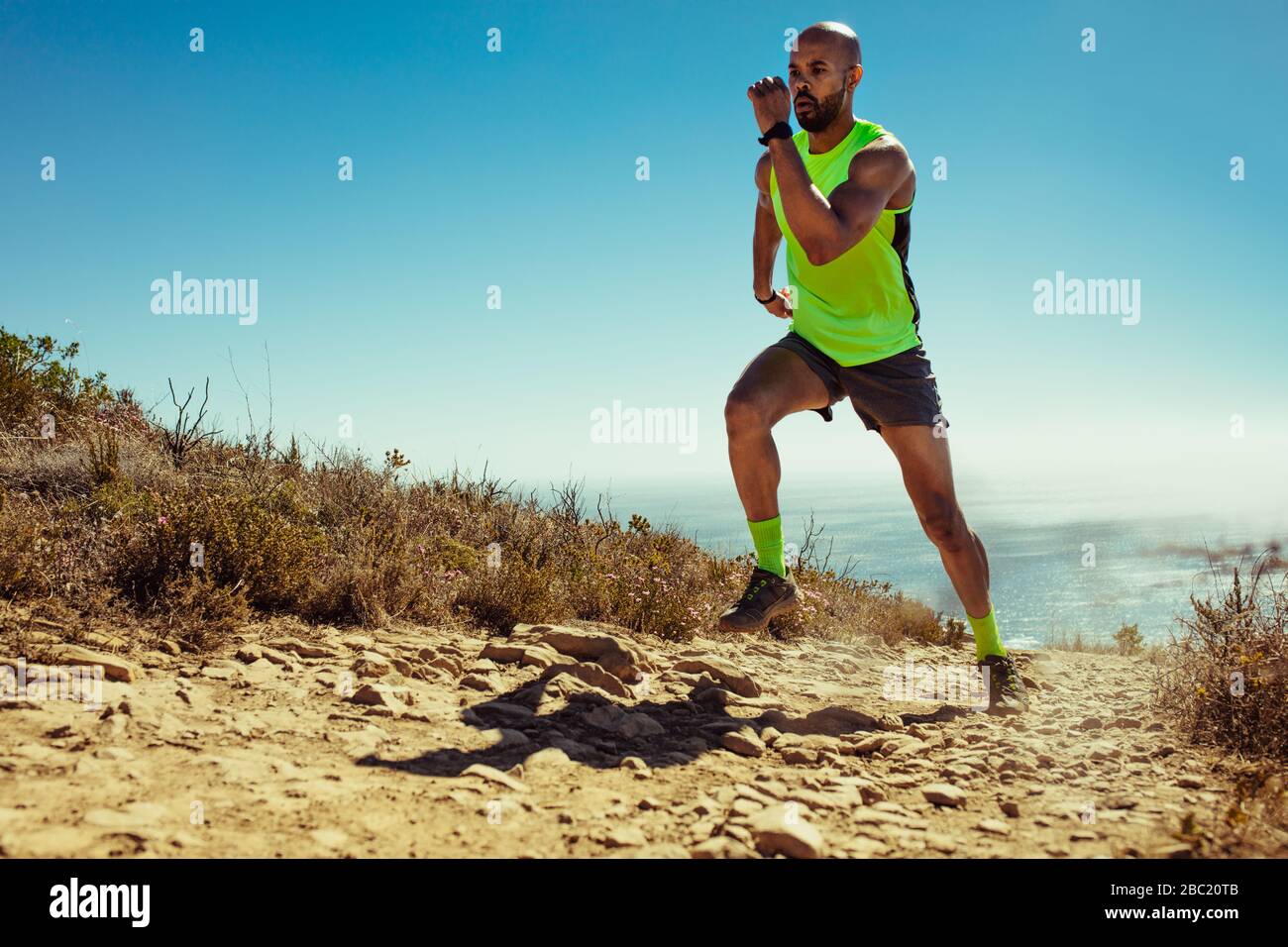 Muscular male runner running hi-res stock photography and images - Alamy