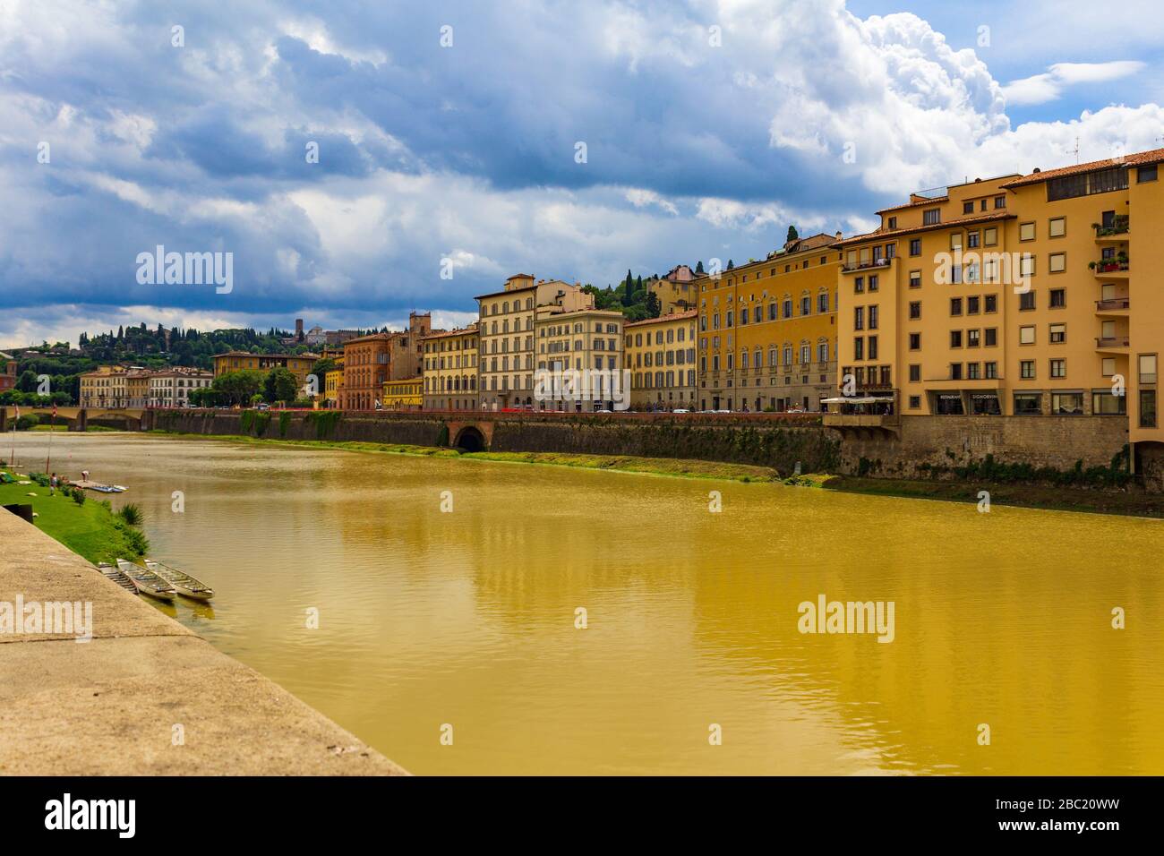Picturesque view of Arno river and riverside historic buildings of the ...