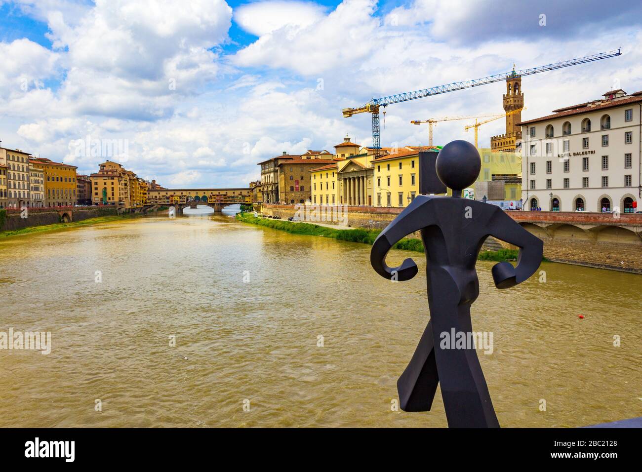 Walking man statue of Clet on the Ponte alle Grazie in Florence and ...