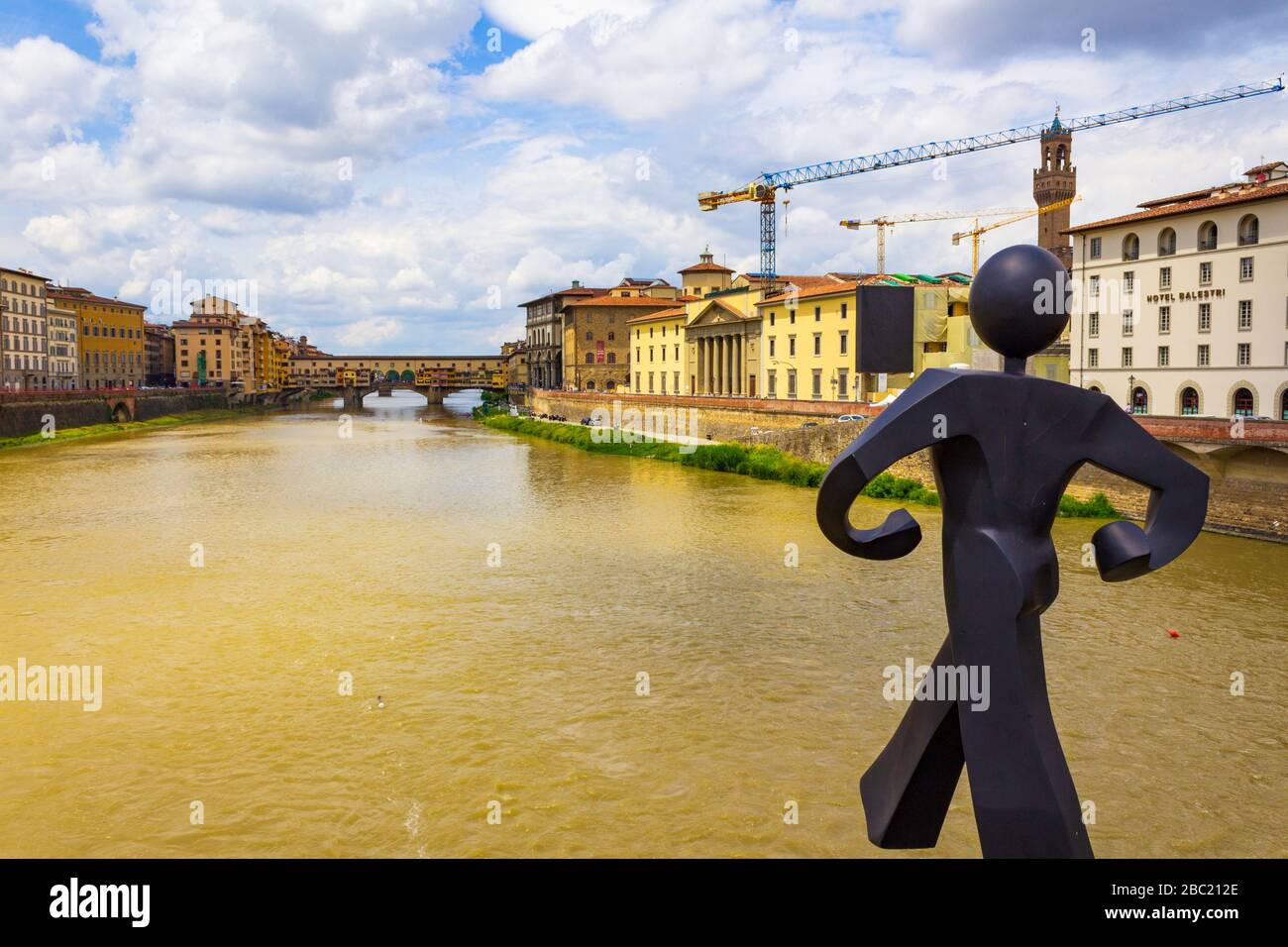 Walking man statue of Clet on the Ponte alle Grazie in Florence and ...