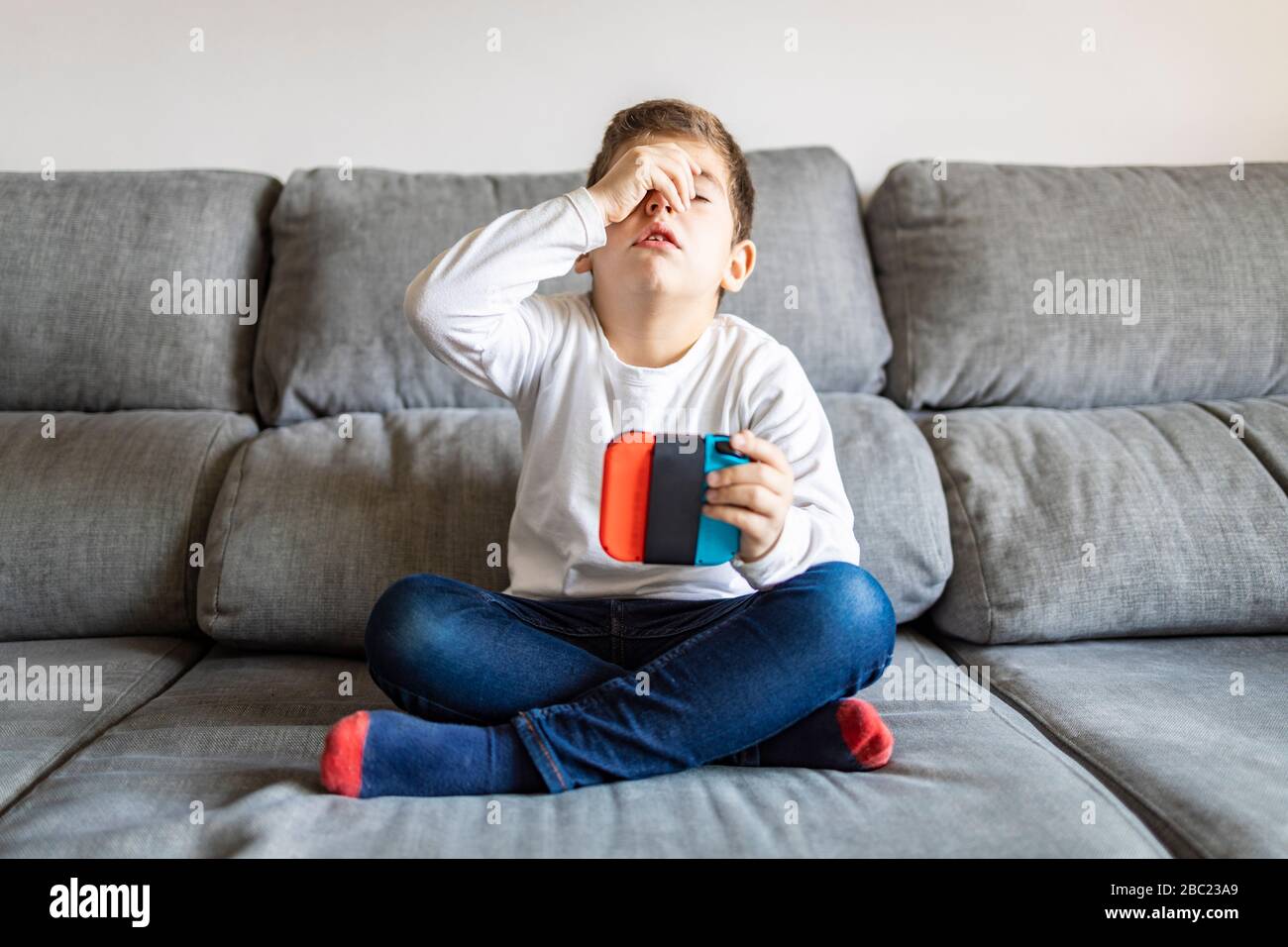 Excited boy playing video games at home Stock Photo - Alamy