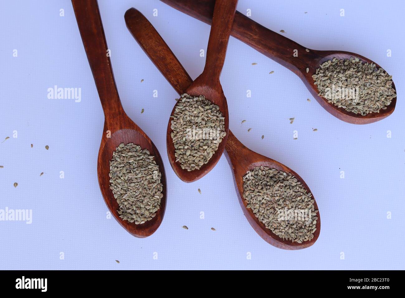 Herbal ajwain seeds over white background Stock Photo - Alamy