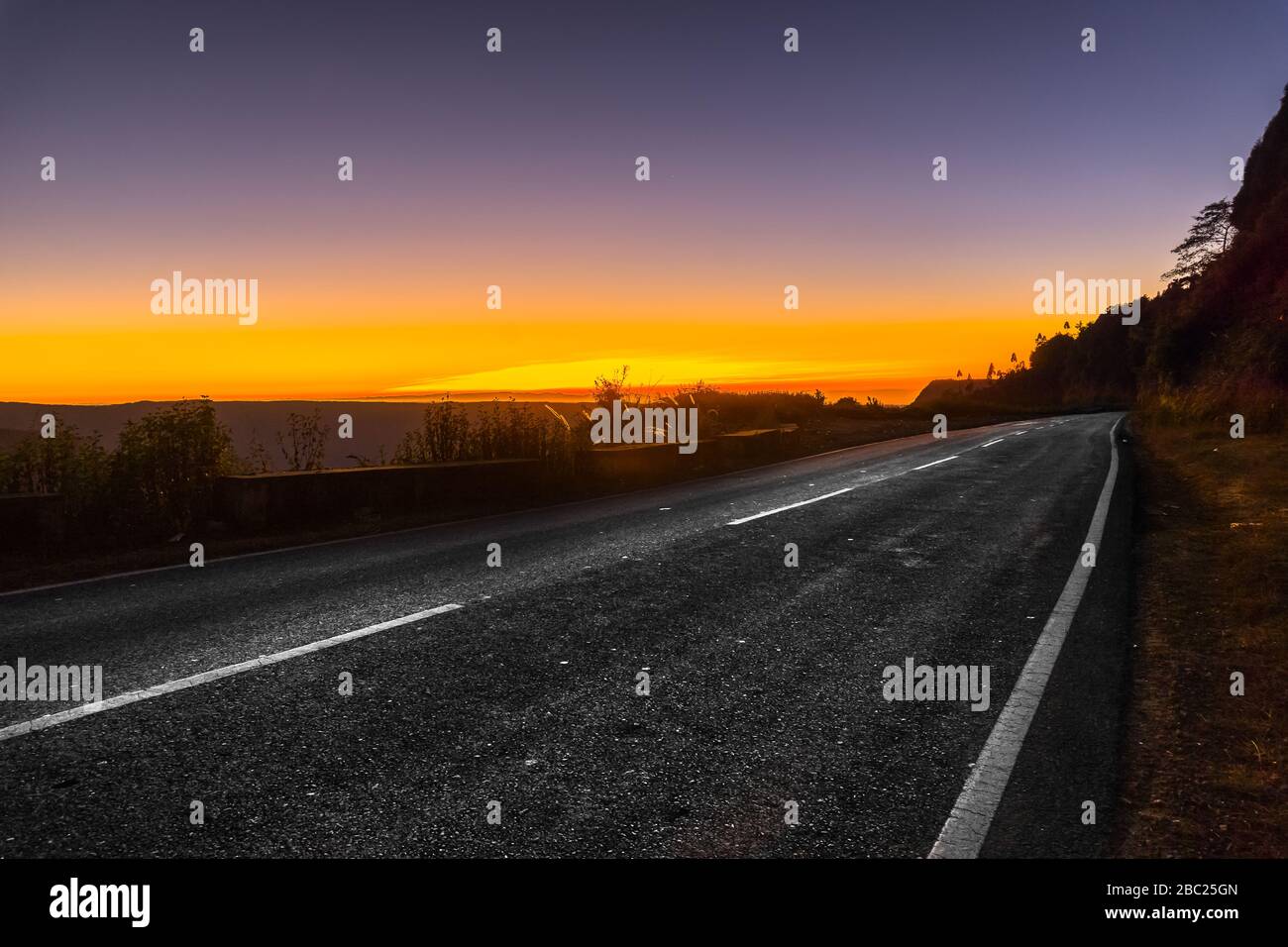 Beautiful sunset clours from golden to red to blue Stock Photo - Alamy