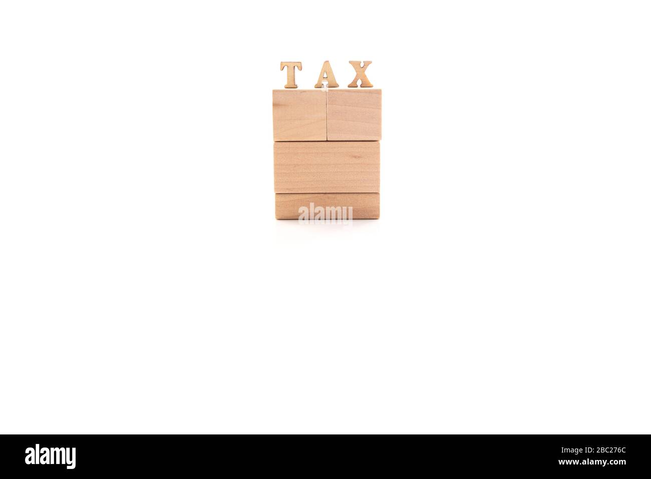 Tax word on natural wood cubes isolated on white background with copy ...