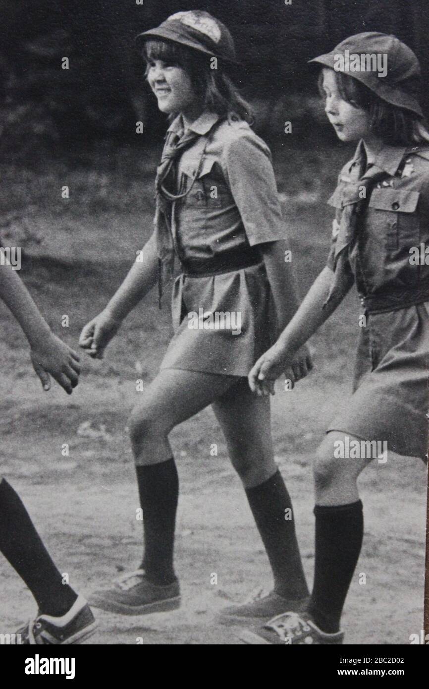 1970s vintage Girl Scouts marching in line at a campsite Stock Photo ...