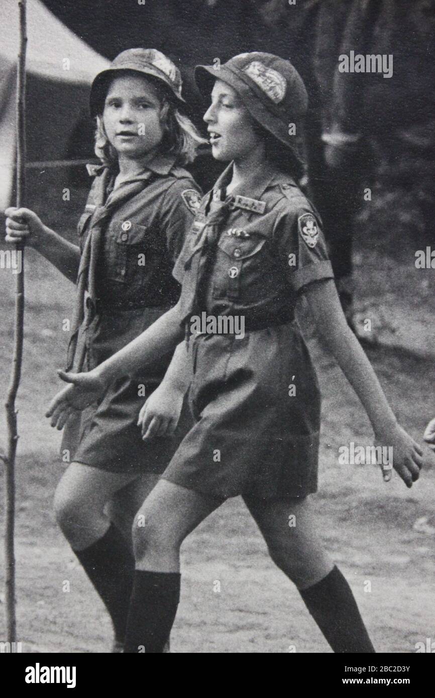 1970s vintage Girl Scouts marching in line at a campsite Stock Photo ...