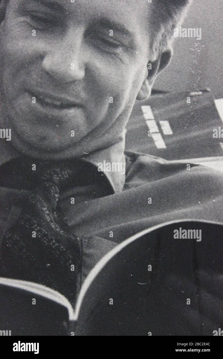 A very happy man reading a journal magazine Stock Photo - Alamy