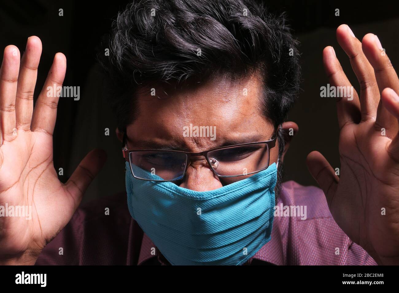 a frustrated man with a mask on his face for antivirus protection Stock ...