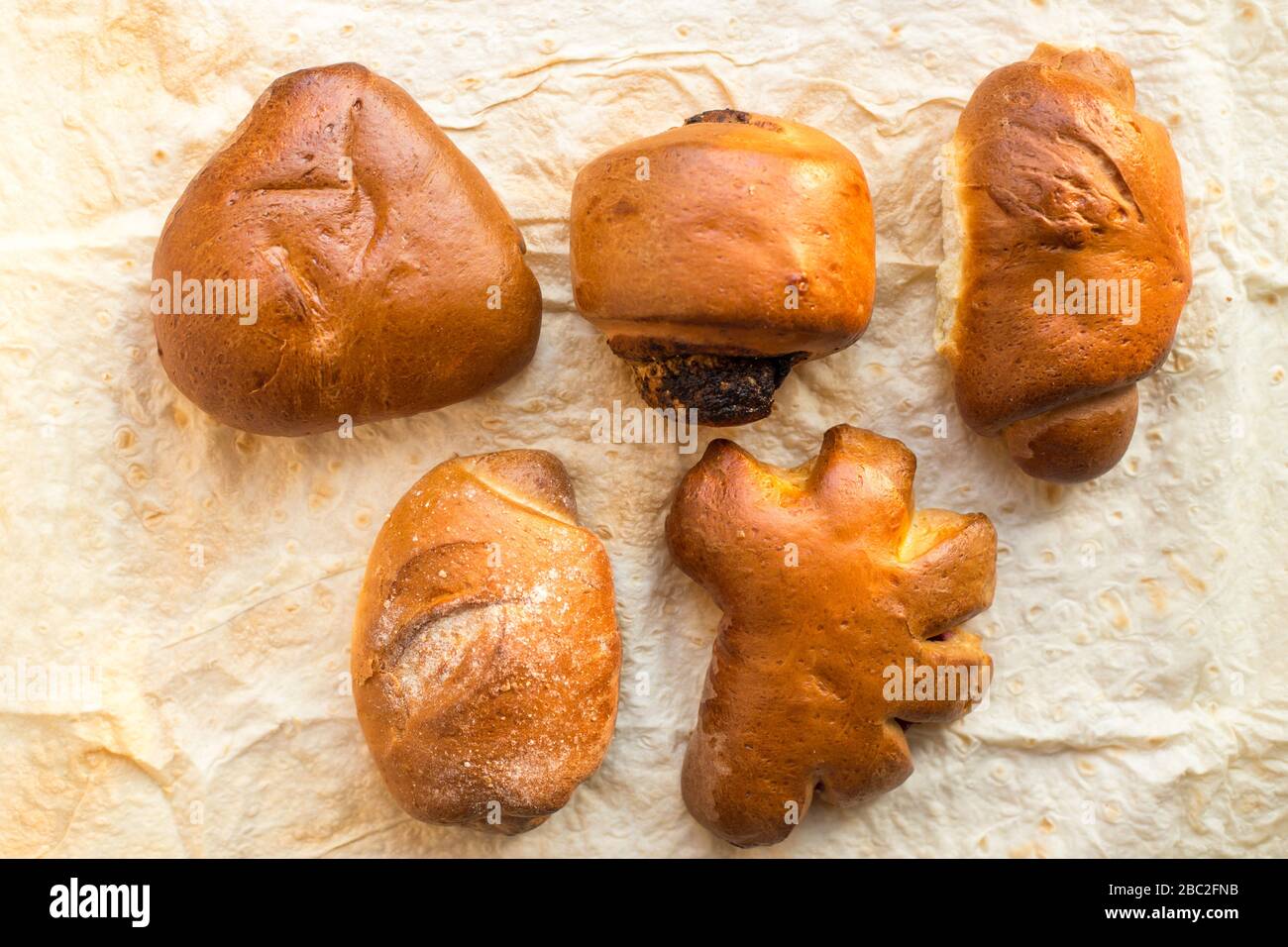 Assortment of healthy buns top view on pita bread Stock Photo - Alamy