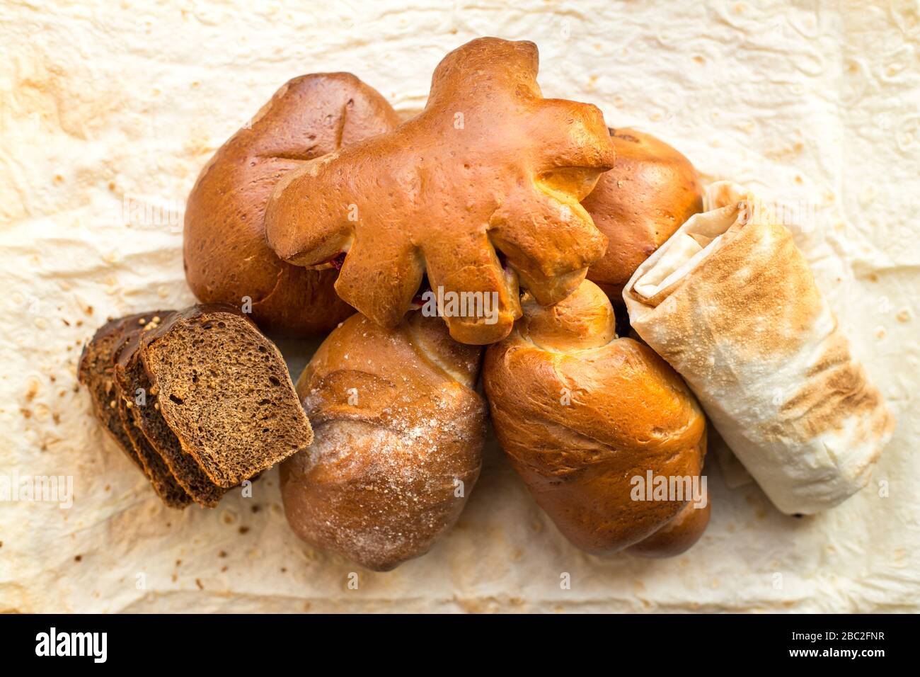 An assortment of bakery products produced by a small bakery. Bread ...