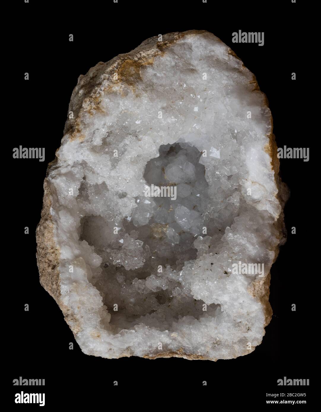 Clear quartz geode isolated on a black background Stock Photo - Alamy