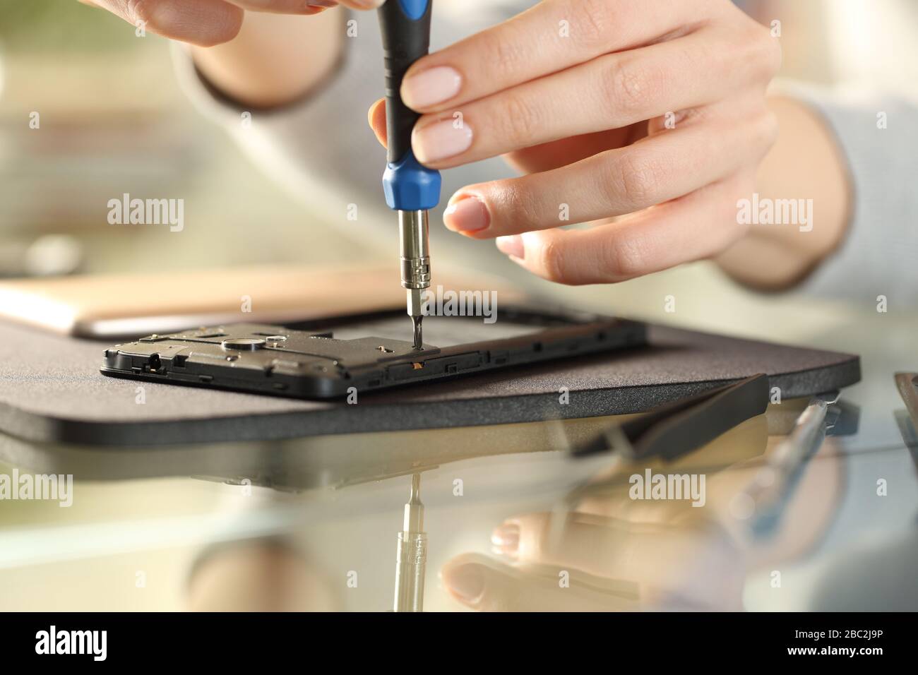 Electronic hands assembling mobile phone hi-res stock photography and ...