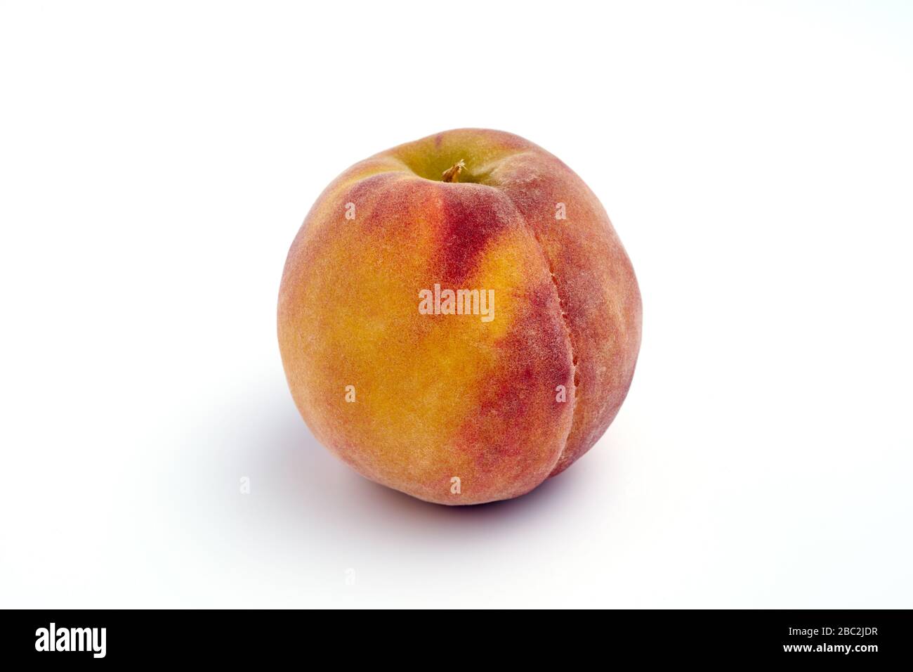 One peach isolated on white background Stock Photo - Alamy