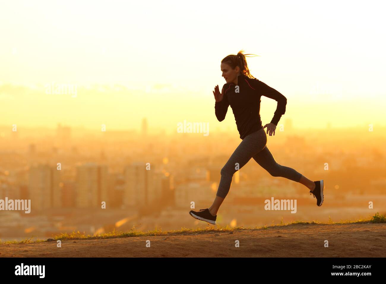 Full woman running in the city hi-res stock photography and images - Alamy