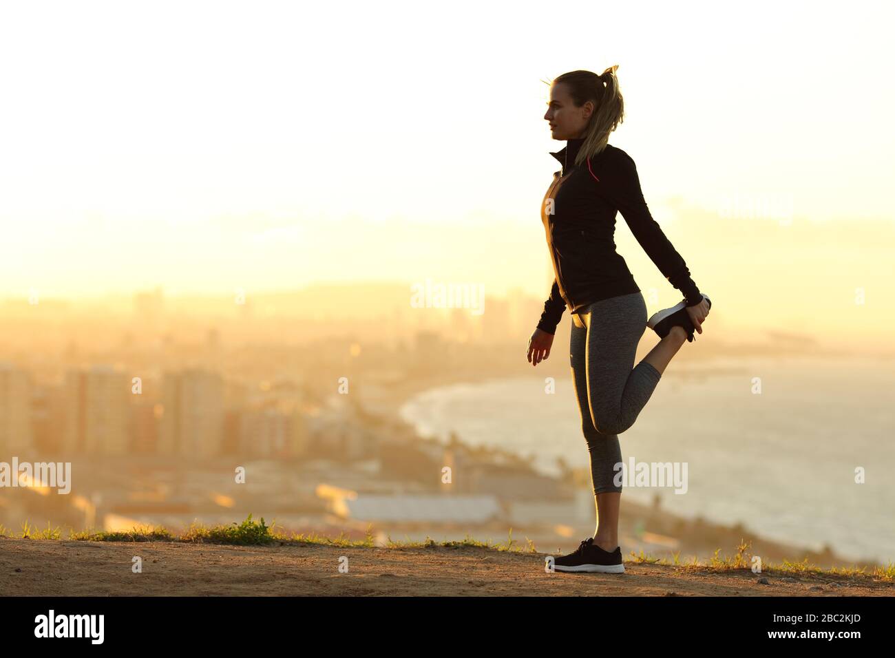 Stretching woman fitness runner hi-res stock photography and images - Alamy