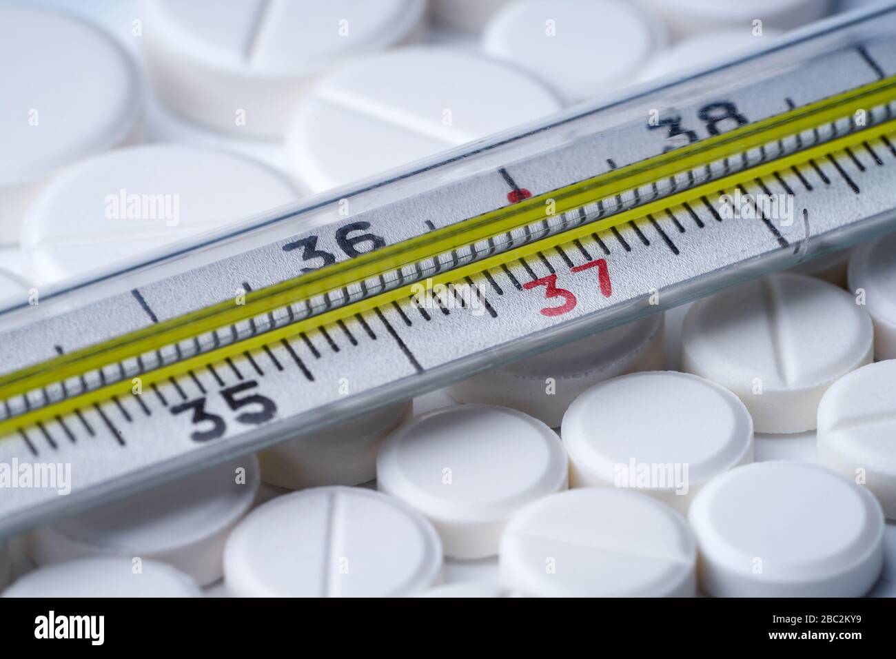 Thermometer for measuring temperature on white tablets Stock Photo - Alamy
