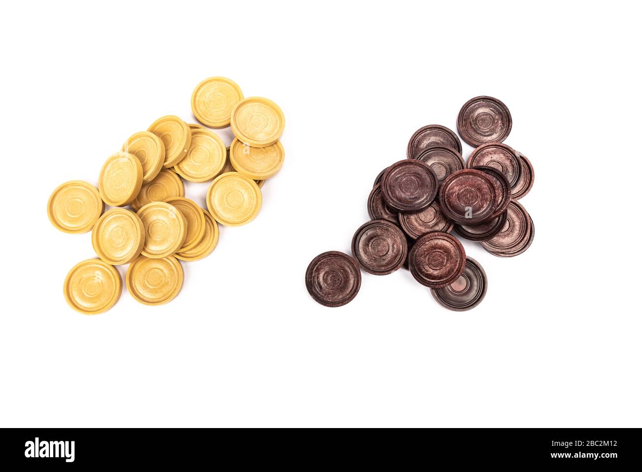 low-end plastic round checkers piece in white background in studio ...