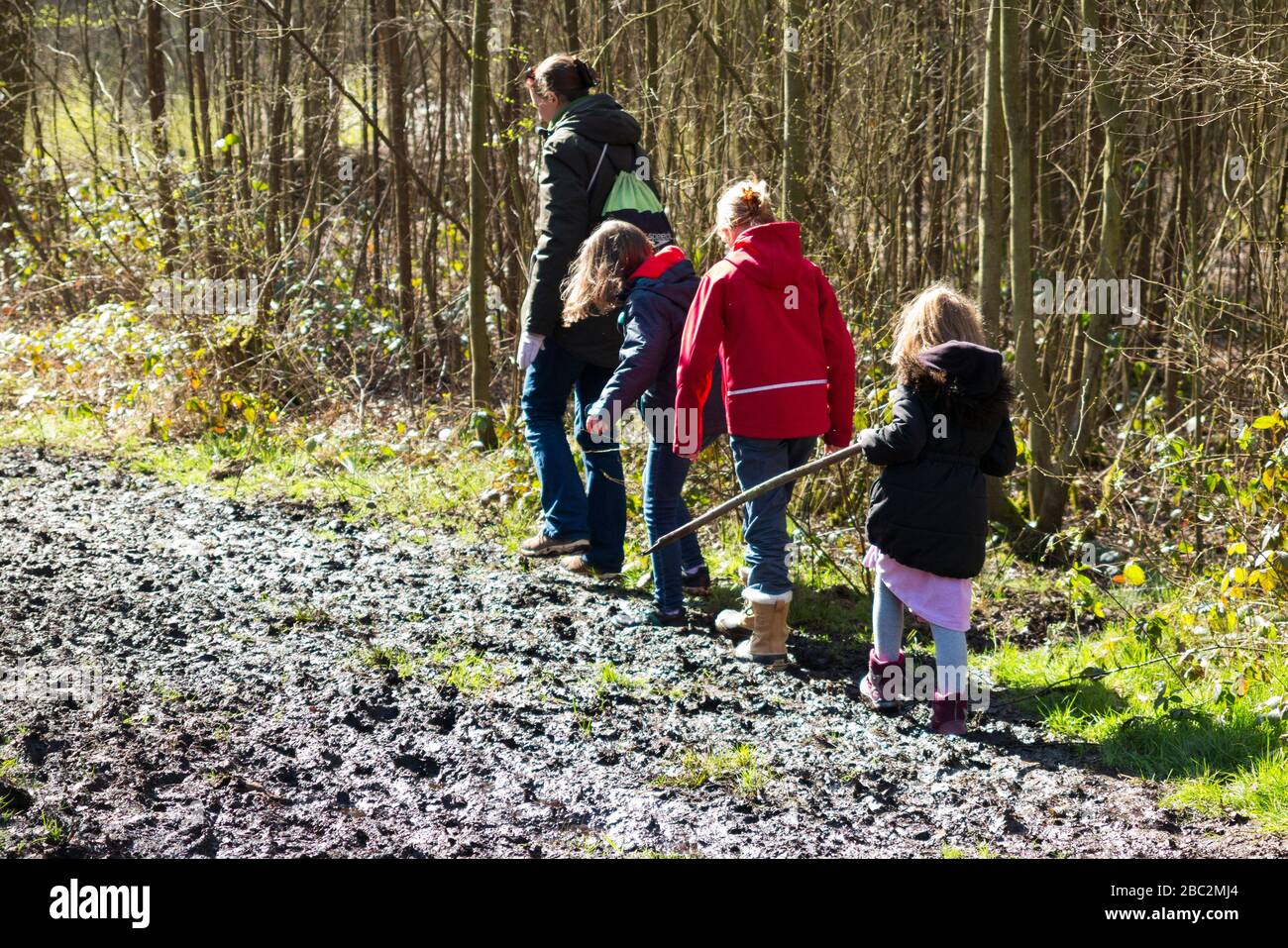 Child walking through mud hi-res stock photography and images - Alamy